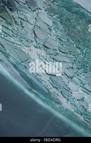 Fractured windshield with radiating cracks. Close-up of spiderweb ...