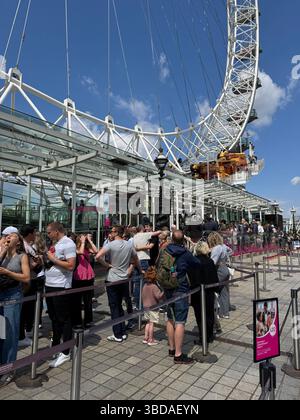 Very busy queue for the London Eye on the South Bank in London, UK ...