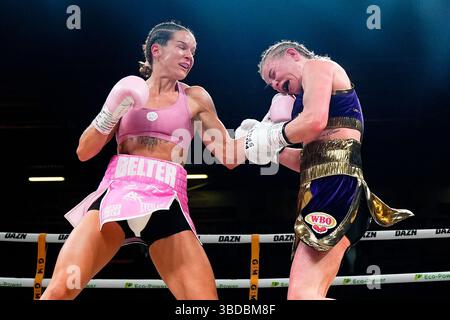Terri Harper (left) and Natalie Zimmermann in action during their WBO ...