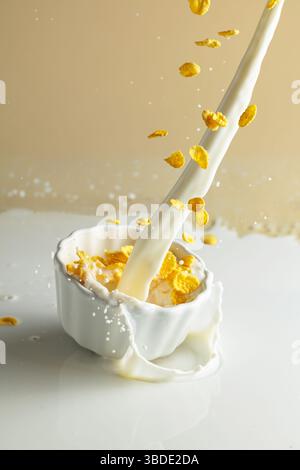 Dry honey cornflakes with milk splashes in a ceramic plate. Flakes with ...