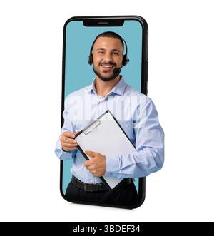 Male technical support agent popping out of smartphone screen on white ...