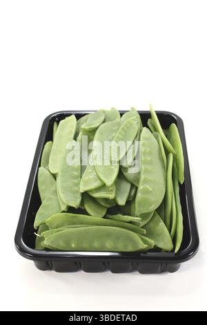 Green peas in the light, the pod glows and peas are visible Stock Photo ...