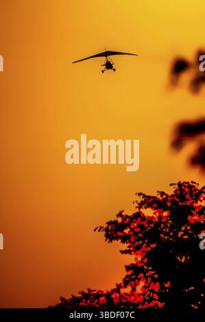 A low angle shot of an airplane in flight Stock Photo - Alamy