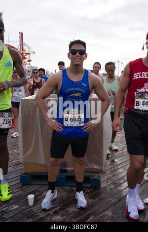 Cardboard box with running shoes on green background Stock Photo - Alamy