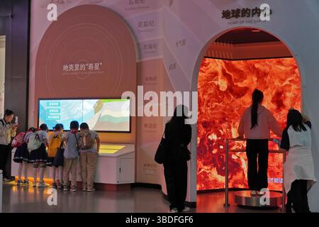 JINAN, CHINA - MAY 24, 2025 - Visitors are viewing a model of a 600 ...