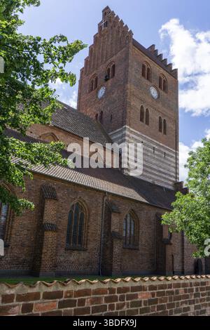 Koge, Denmark - 12 June, 2021- narrow cobblestone street with colorful ...