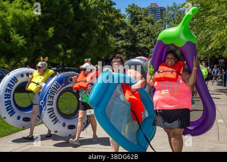 People participate in a walking event in Qinhuangdao City, north China ...