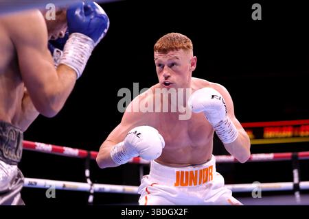 Alex Arthur Jr (right) in his corner in the super middleweight bout ...