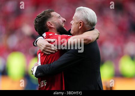 Aberdeen's Graeme Shinnie and owner Dave Cormack (right) celebrate ...