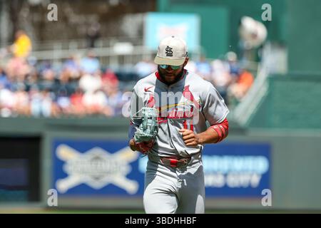 St. Louis Cardinals' Victor Scott II bunts during the ninth inning of a ...