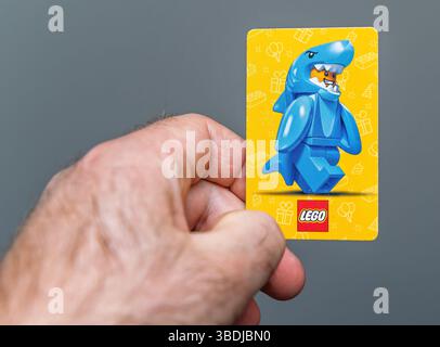 yellow lego figure with a smile on his face on a blue background with a ...