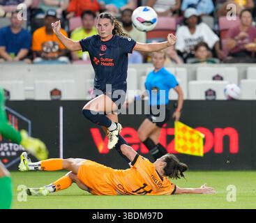 Bay FC midfielder Caroline Conti, left, kicks the ball as Angel City FC ...