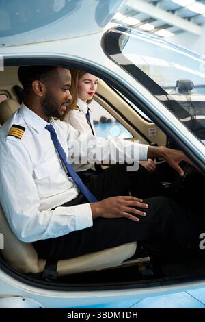 Student pilots training inside aircraft cockpit simulator Stock Photo ...