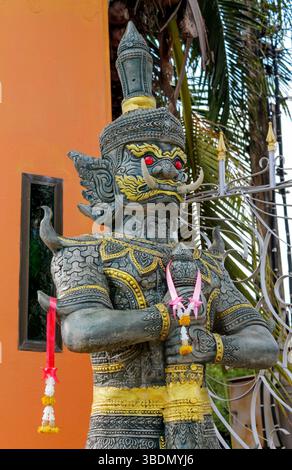 Colorful guard Yaksha statue in a Buddhist temple Wat in Thailand ...