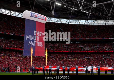 Pyrotechnics are set off as the teams make their way onto the pitch ...