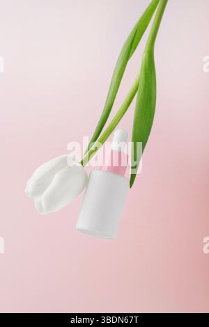 Perfume bottle for women in flower buds Stock Photo - Alamy