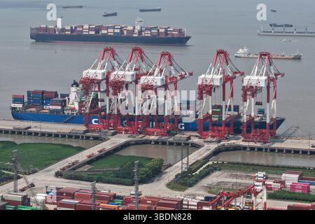 A cargo ship passed outside an export container terminal in Shanghai ...