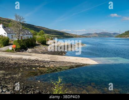 Sloping concrete Kylerhea ferry jetty / slipway and the calm clear ...