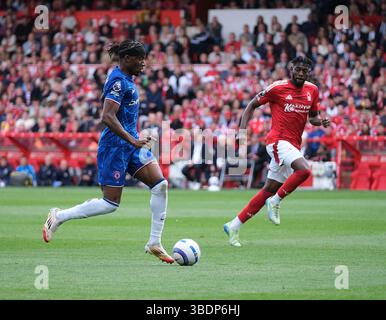 Ibrahim Sangare of Nottingham Forest under pressure from Alex Iwobi of ...