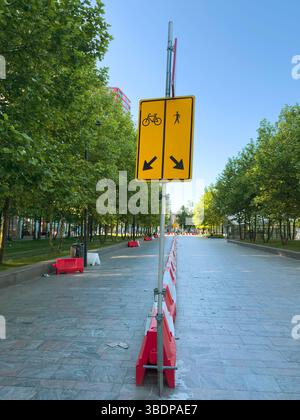 Traffic lanes temporary separation with red and white plastic barriers ...