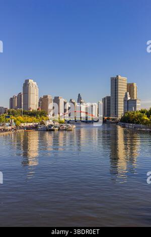 Hai River with cruise boat harbor and apartment buildings in Tianjin ...