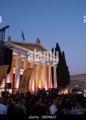Athens, Greece - May 4 2025: Crowd gathered at an outdoor event with a ...