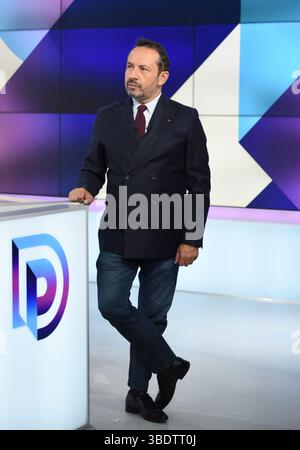 Sebastien Chenu poses for pictures ahead of an interview for Dimanche ...