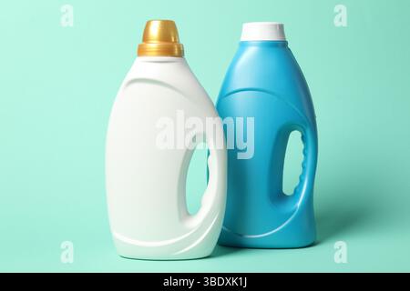 Bottles of fabric softener on turquoise background Stock Photo - Alamy
