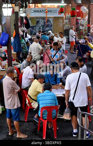 Groups of people congregate to play draughts and other board games on ...