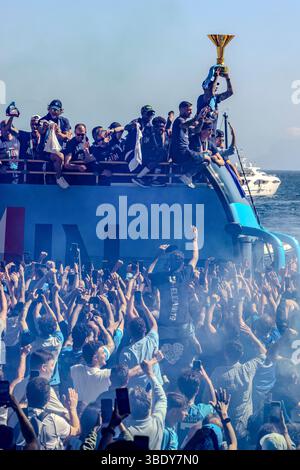 Napoli players and staff parade on a bus to celebrate the scudetto ...