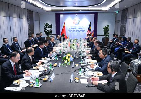 Malaysian Prime Minister Anwar Ibrahim, right, attends a meeting with ...