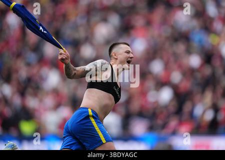 AFC Wimbledon's James Tilley celebrates promotion after the final ...