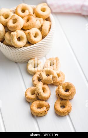 Salted crispy snack rings on a kitchen table Stock Photo - Alamy