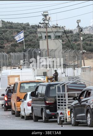 Nablus, Palestine. 26th May, 2025. An Israeli soldier stops Palestinian ...