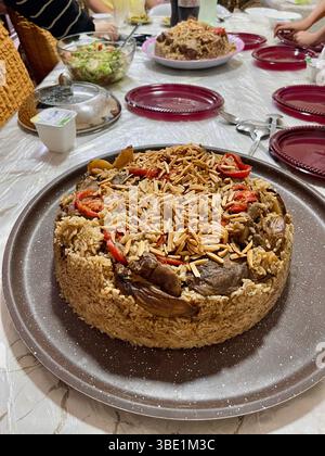 stew soup with vegetables, beef ribs and cilantro in black plate at ...