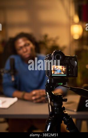 Blurred background of man recording video or taking picture by ...