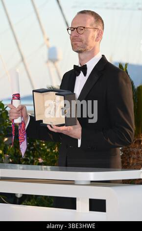 Director Joachim Trier, winner of the grand prix for the film 'Sentimental Value', poses for ...