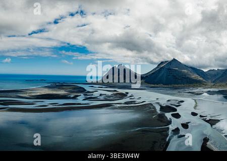 Aerial view of Brunnhorn mountain and braided glacial rivers, East ...