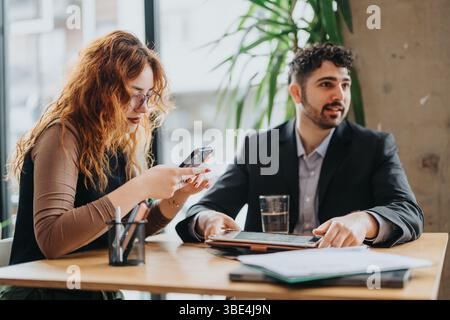 Business people collaborating in a rustic co-working cafe environment ...