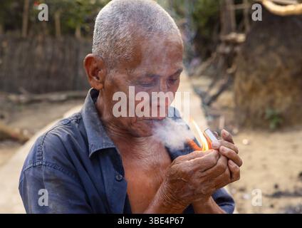 Marma old man smoking a cigar, Chittagong Division, Rowangchhari ...