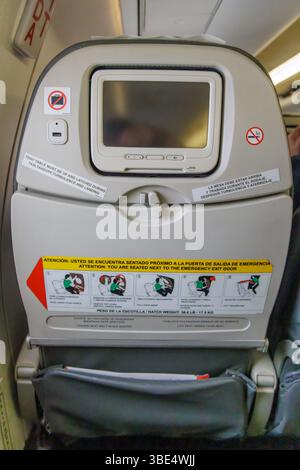 Airplane seat cabin safety instructions sheet information on seat table ...