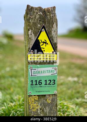Wooden sign warning of danger near cliff on the Cape to Cape trail ...