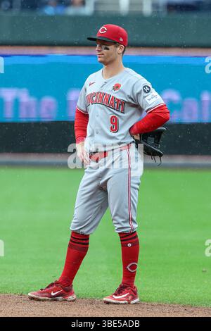 Cincinnati Reds second baseman Matt McLain, left, looks to throw to ...