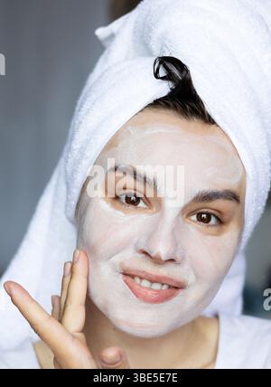 Woman with cleansing black mask on her face Stock Photo - Alamy