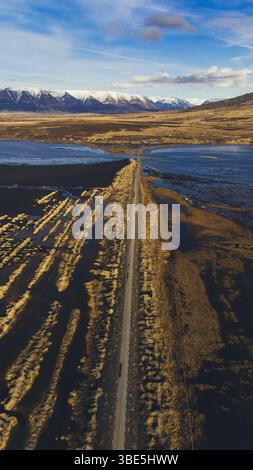 Aerial shot of a road through the snow-covered forest Stock Photo - Alamy