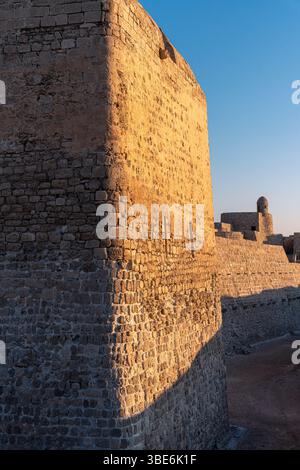 ancient stone walls of Qal'at al-Bahrain, a Bahraini fort dating back ...