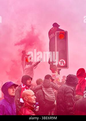 Liverpool fans watch on as the team bus approaches during the Premier ...