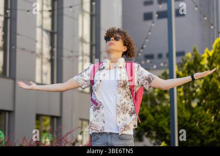 Calm caucasian curly male keep calm, meditating isolated in studio on ...