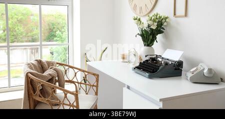 Chair with vintage typewriter and flowers in garden on spring day Stock ...