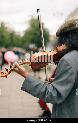 Portrait of male fiddler playing classical music on violin. Violinist ...